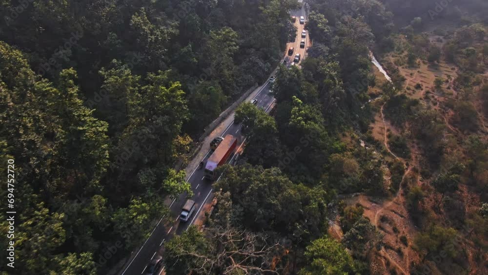 Aerial view of a beautiful hilly area with a highway. Drone view of a ...