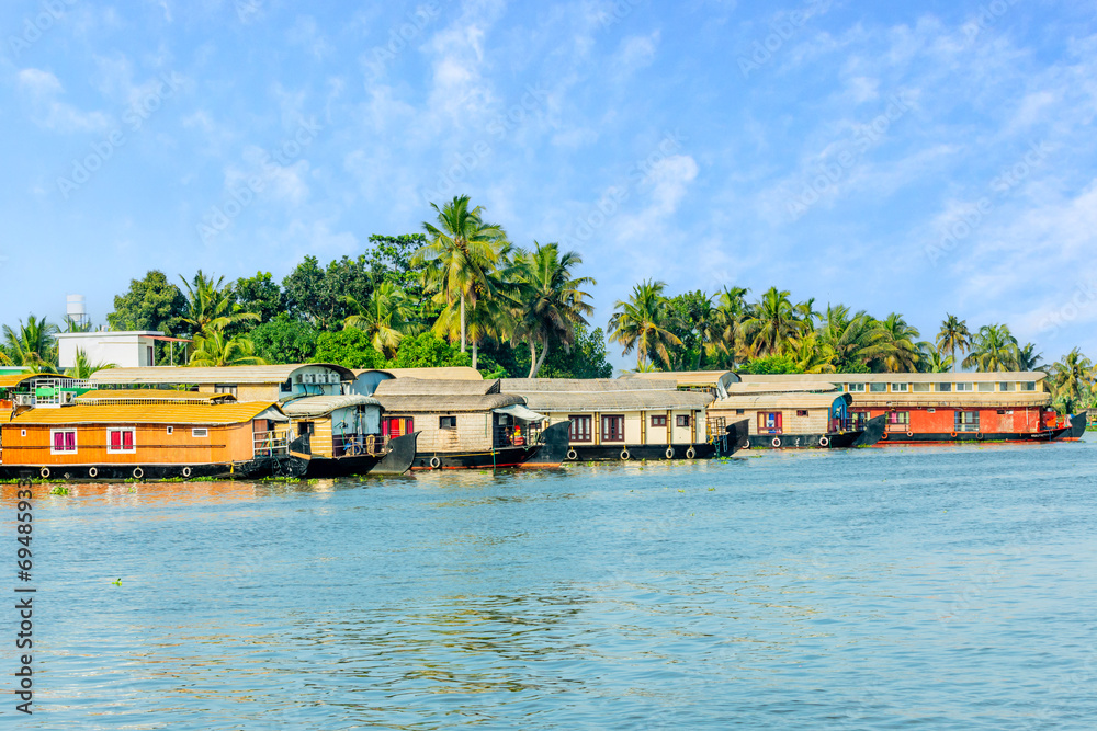 Indian traditional house boats anchored at Pamba river coastline, with ...