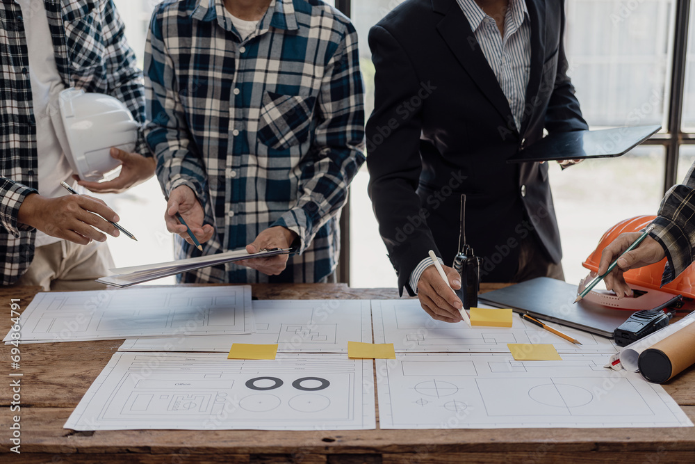 Engineering teams work in blueprint meetings for the project, working ...