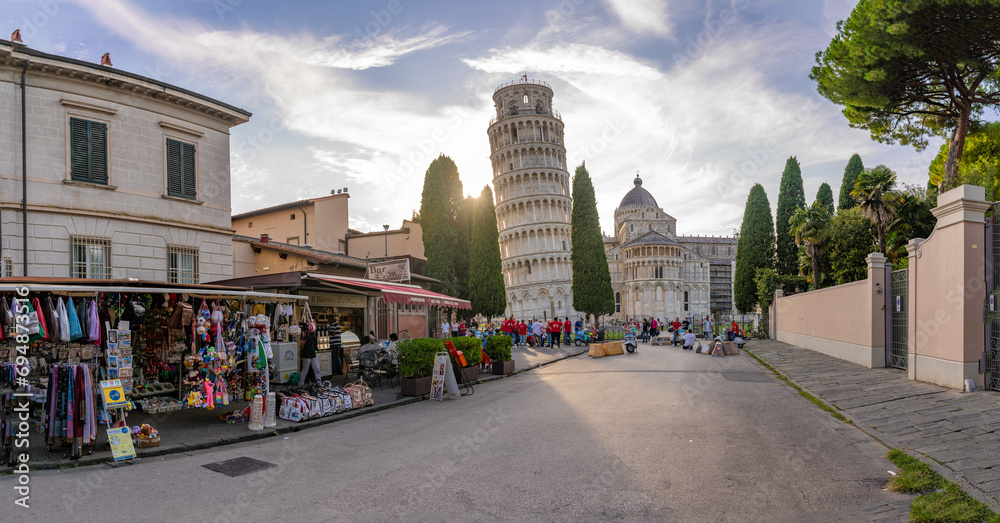View of souvenir stalls and Leaning Tower of Pisa at sunset, UNESCO ...