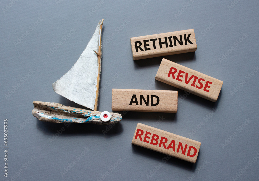 Rethink Revise and Rebrand symbol. Wooden blocks with words Rethink ...