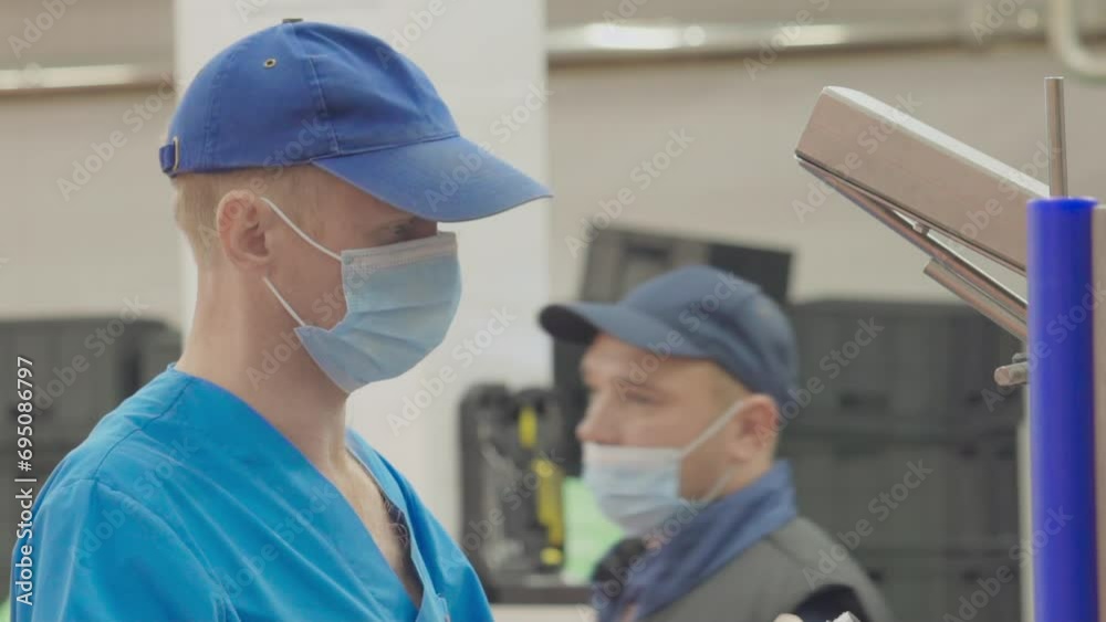 Masked Male Worker Loading Milk Bottles For A Conveyor Production ...