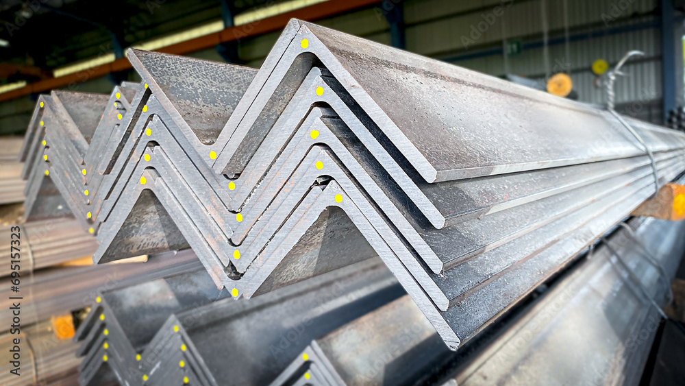 Stacks of angle iron in a factory on shelves in a warehouse Metal ...