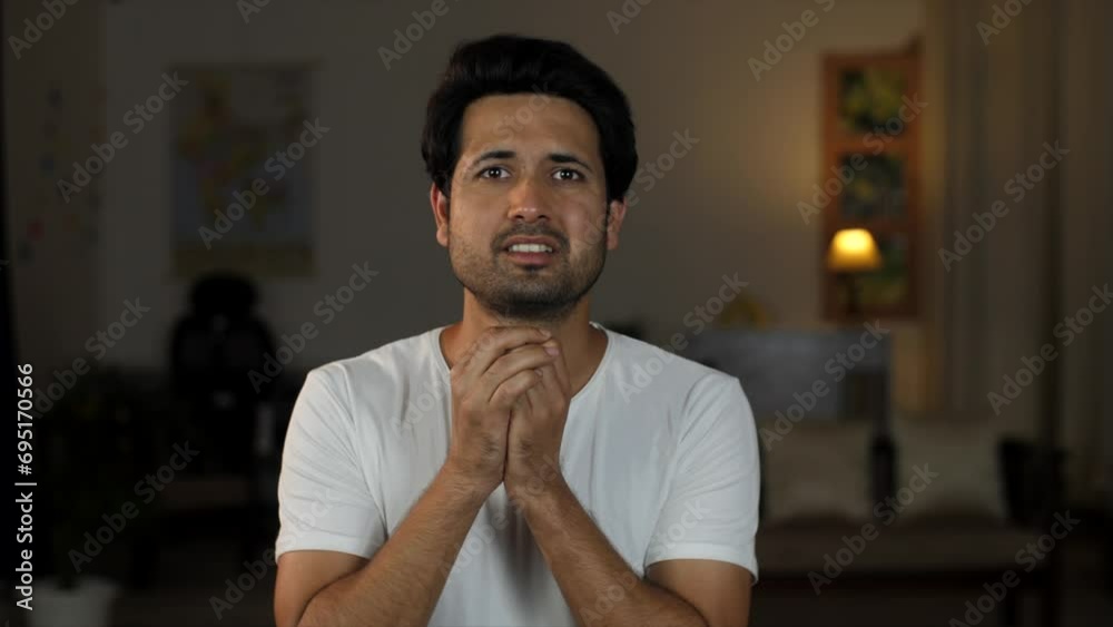 A young shocked Indian man looks at the camera - shocked expression ...