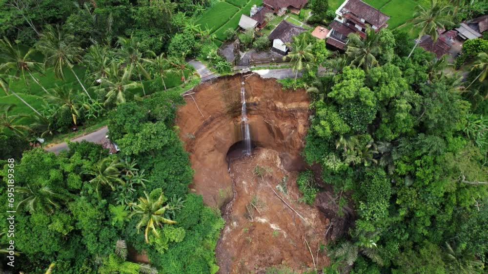 Water falling from damaged irrigation ditch, local landslide destroyed ...