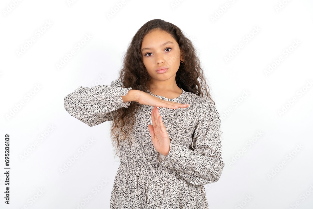 Beautiful teen girl wearing flowered dress being upset showing a ...