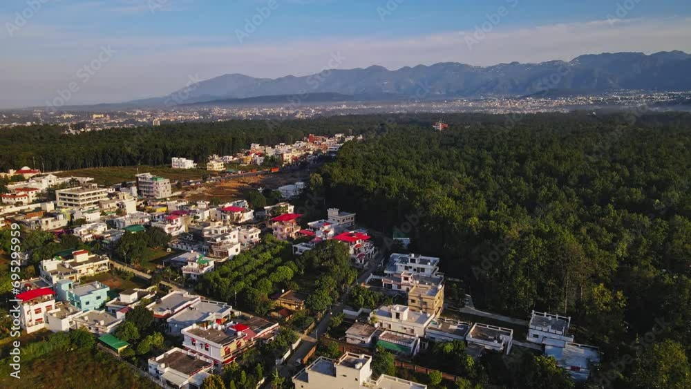 An aerial view of Dehradun, an Indian city during sunrise or sunset ...