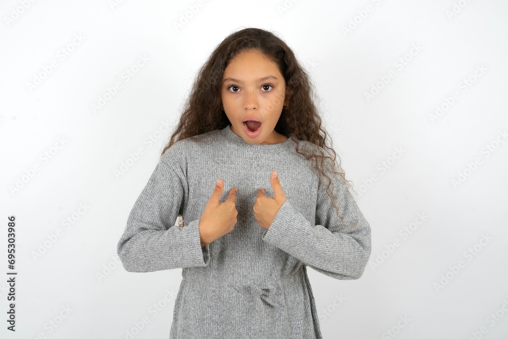 Embarrassed Beautiful teenager girl indicates at herself with puzzled ...