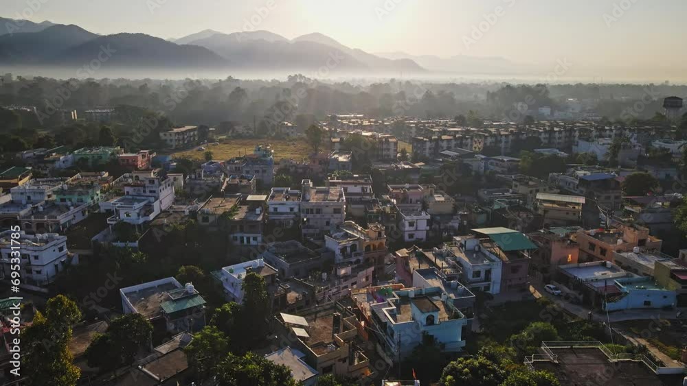 An aerial view of Dehradun, an Indian city during sunrise or sunset ...