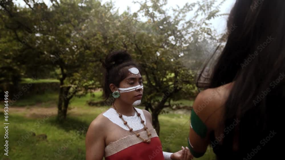 Confident young female Mayan warriors in traditional dress and body ...