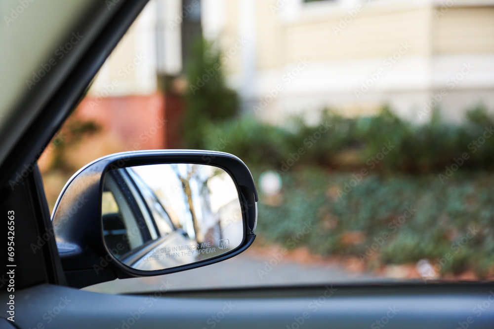 reflection in car mirror, conveying introspection and perspective in a ...