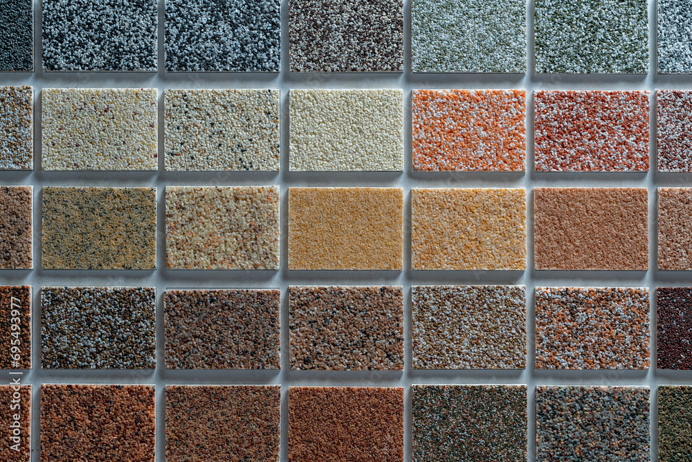 Samples of multi colored plaster for the decoration of the facade and ...