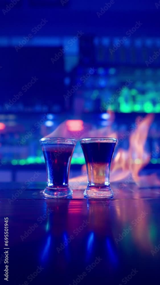 Vertical Video, Two Glass of Alcoholic Drink on a Bar Counter Close-up ...