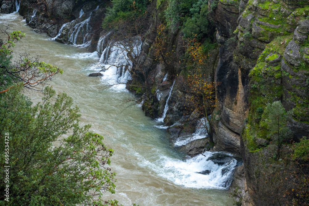 Transparent waters of Kopru River (Köprüçay, ancient Eurymedon) with ...