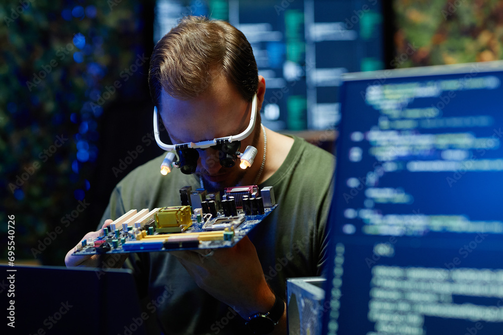 Young military officer or repairman wearing eyewear with small lamps ...