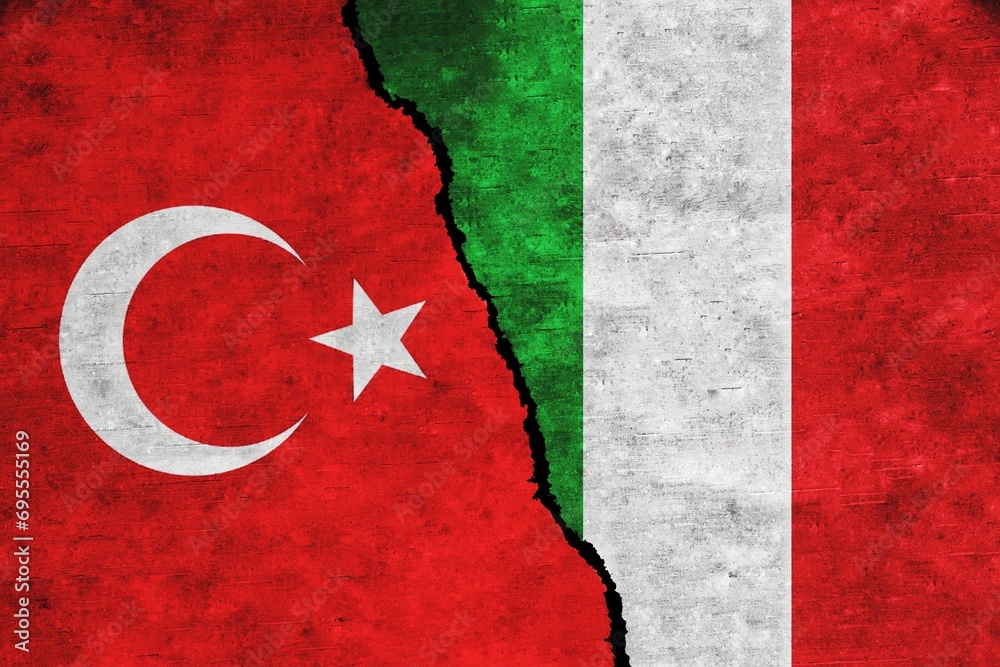 Turkey and Italy painted flags on a wall with a crack. Tutkey and Italy ...