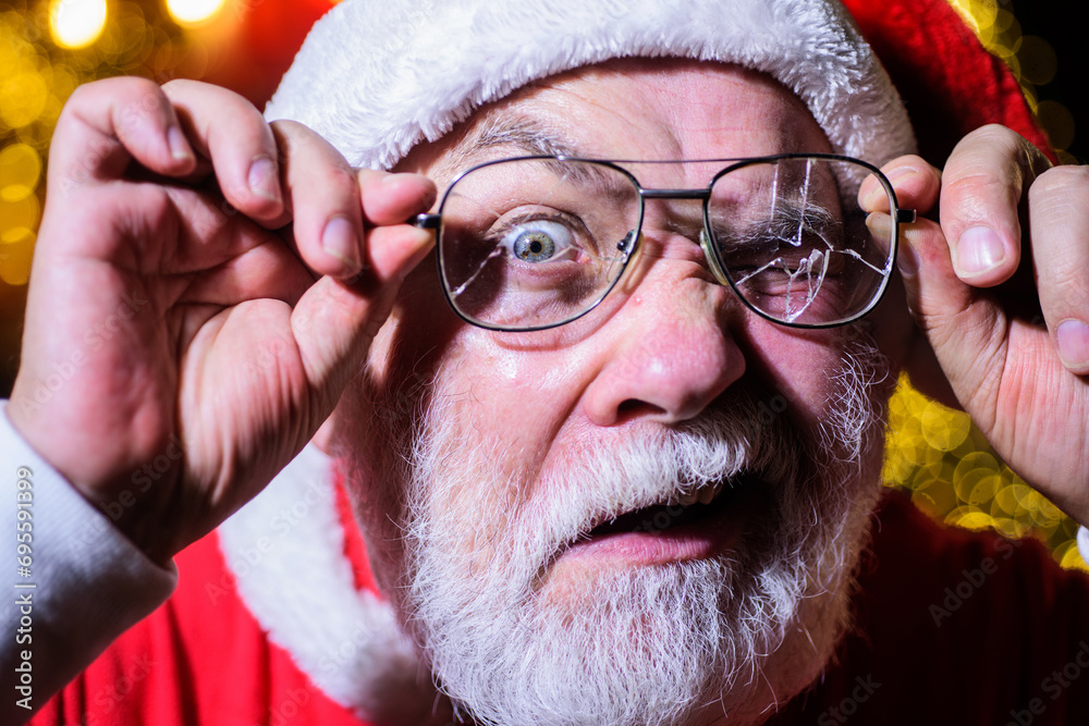 Christmastime. Santa Claus with broken glasses. Bearded man in Santa ...