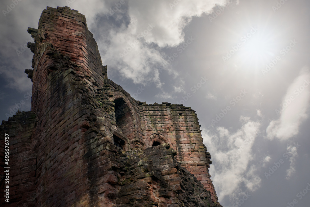 Bothwell Castle is a large medieval castle, sits on a high, steep bank ...