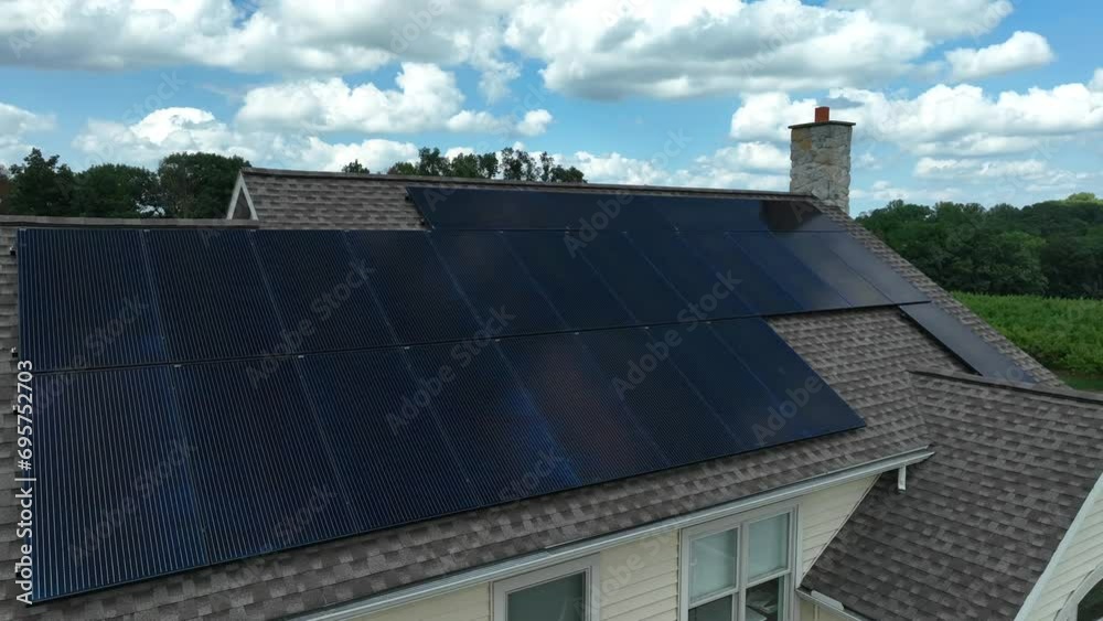 Solar panels on house with shingle roof on bright sunny day ...
