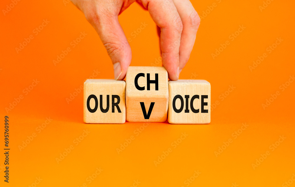 Our voice choice symbol. Businessman turns wooden cube and changes ...