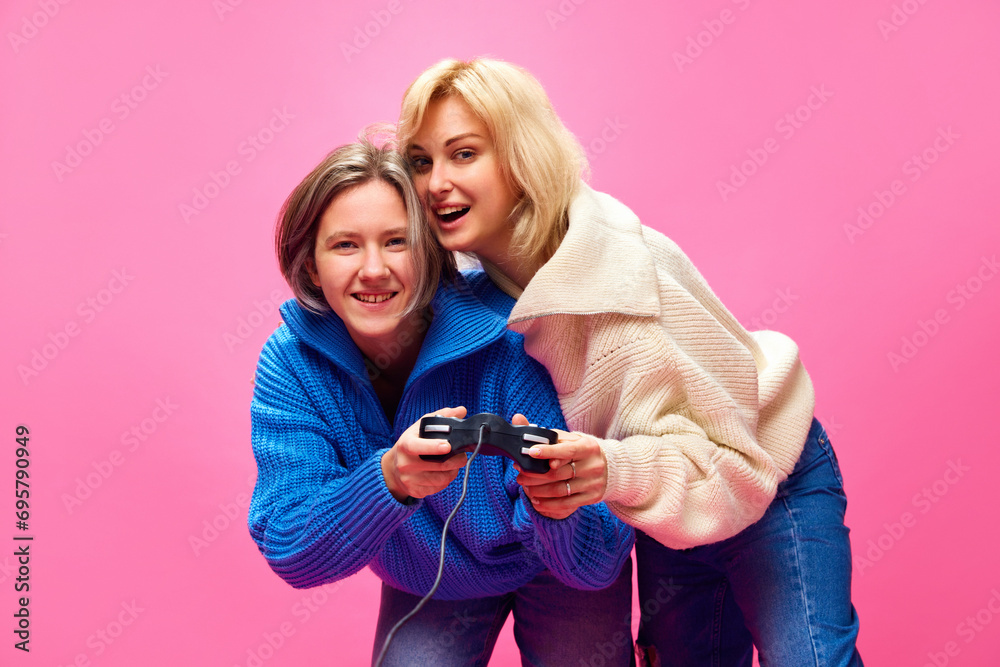 Beautiful Young Women Lesbian Couple Playing Play Station Video Games