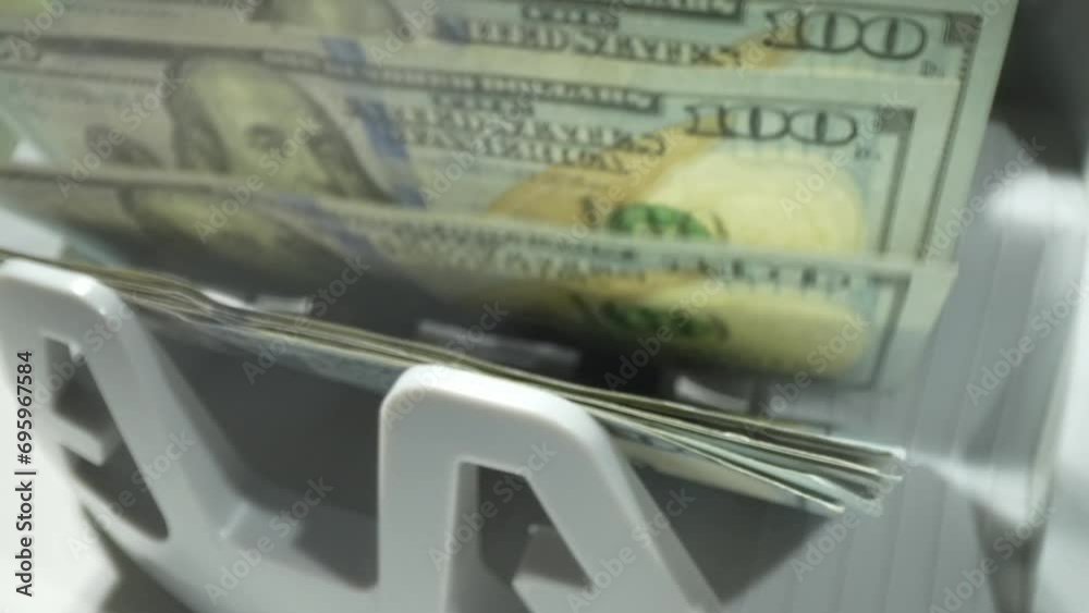 Cash money inside running banknotes counter. Banking and financial ...