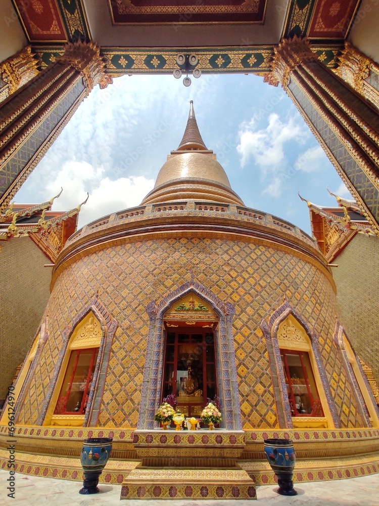 Wide angle of golden pagoda and the curved walkway around the circular ...