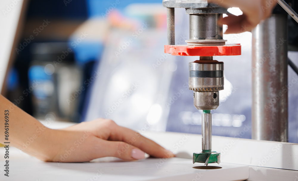 Owner Worker young woman on workplace of milling machine with wooden ...