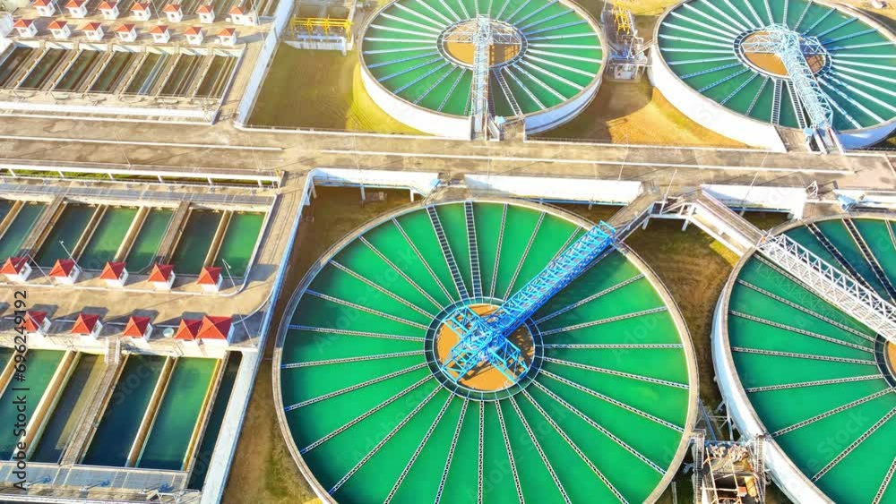 A drone aerial view of a wastewater treatment plant reveals a complex ...