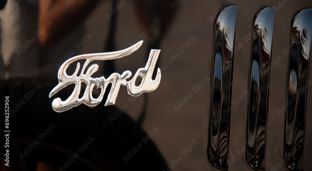 Logo of a Ford car on black metal vehicle body Stock Photo | Adobe Stock