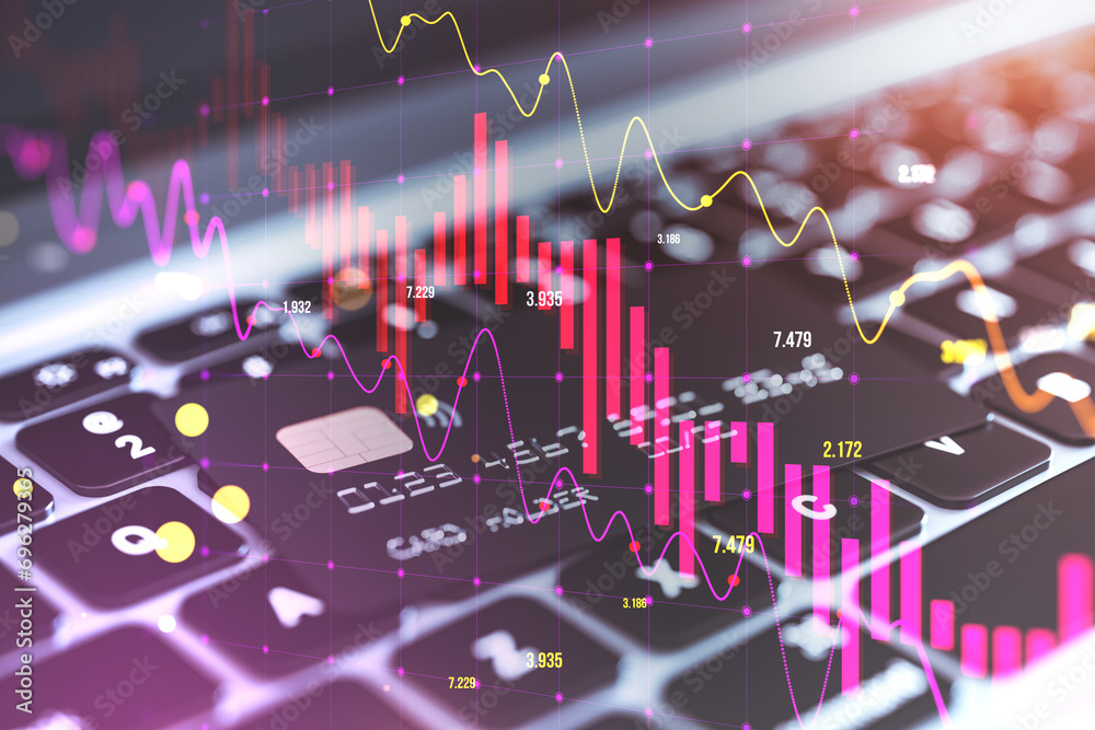 Close up of laptop keyboard with bank card and falling candlestick forex chart and index on ...