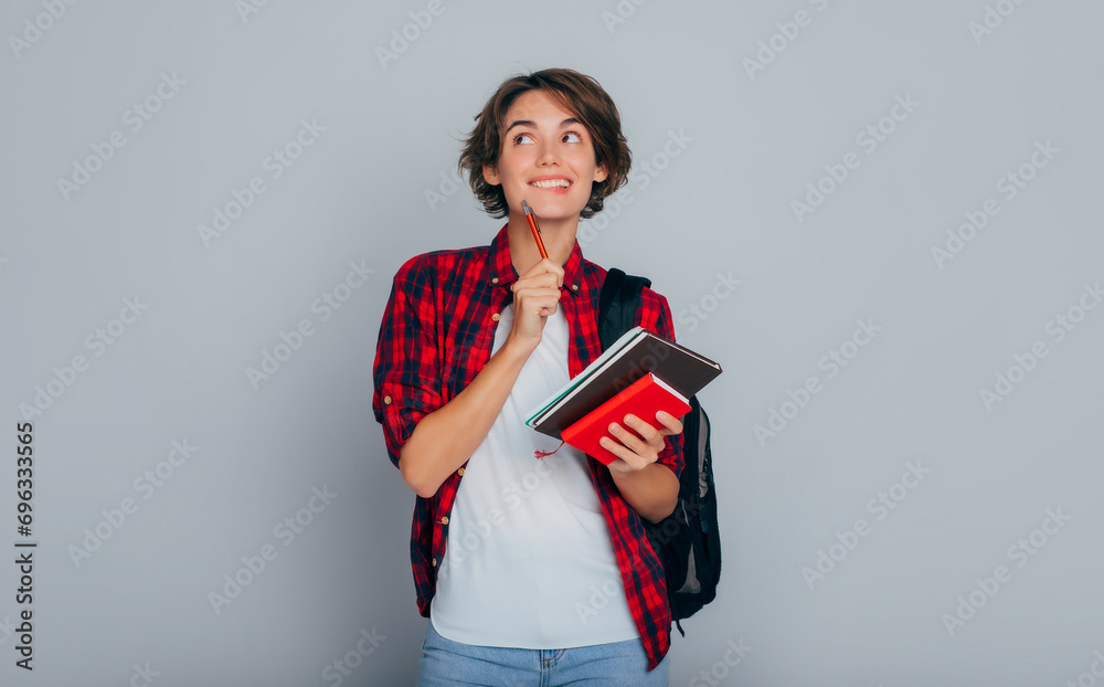An interested, thoughtful, beautiful student woman with a backpack, a ...