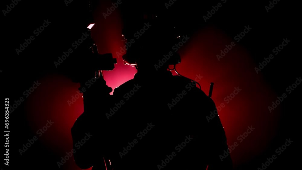 Silhouette of military soldier in army camouflage, warrior with weapon ...