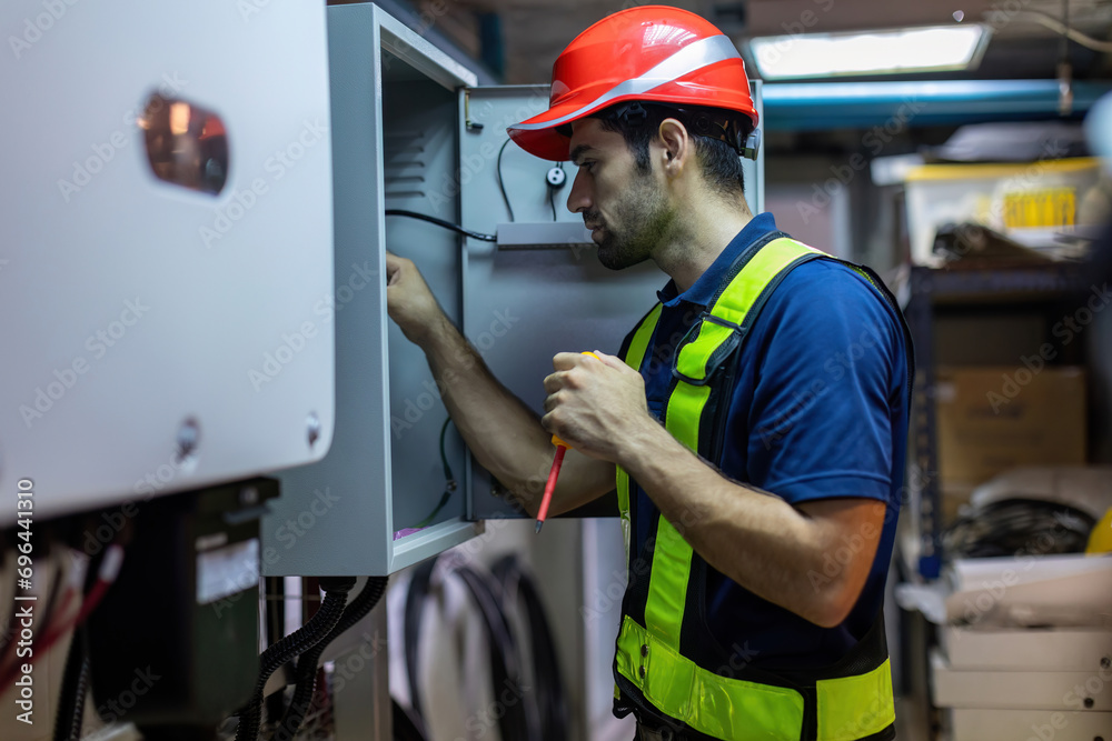 Electrical engineer working in control room. Electrical engineer man ...