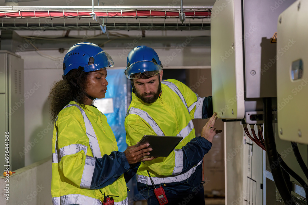 Electrical engineer working in control room. Electrical engineer man ...