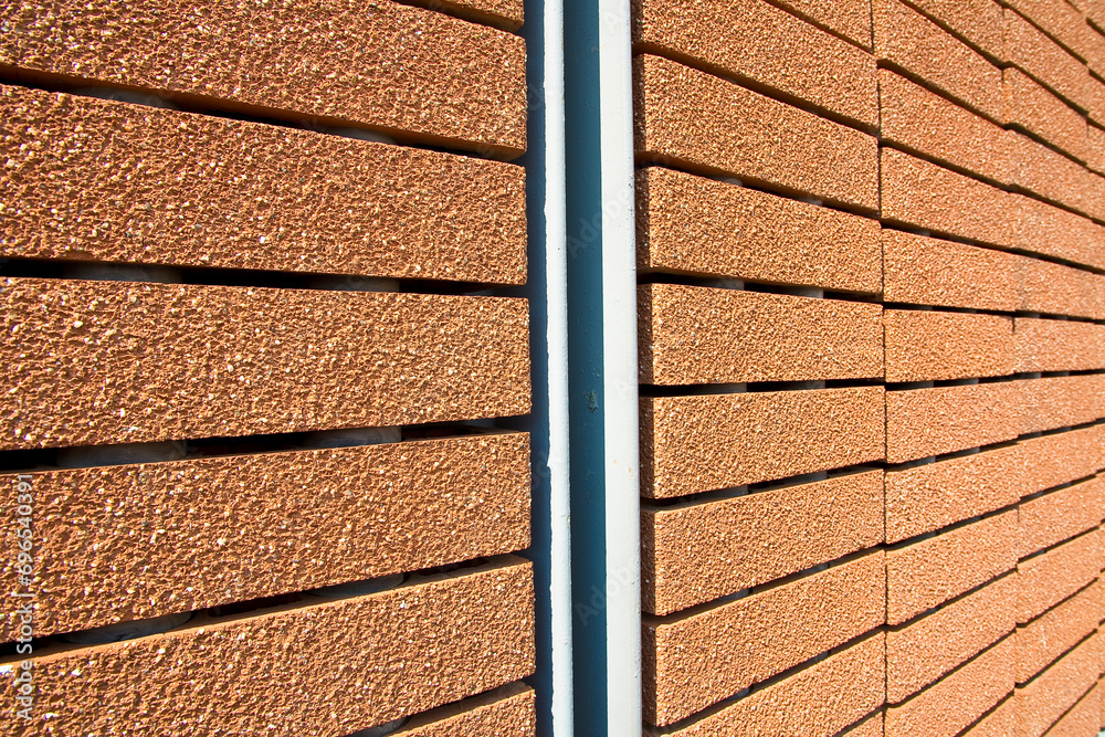 New performing modern exposed brick wall made with blocks with surface ...