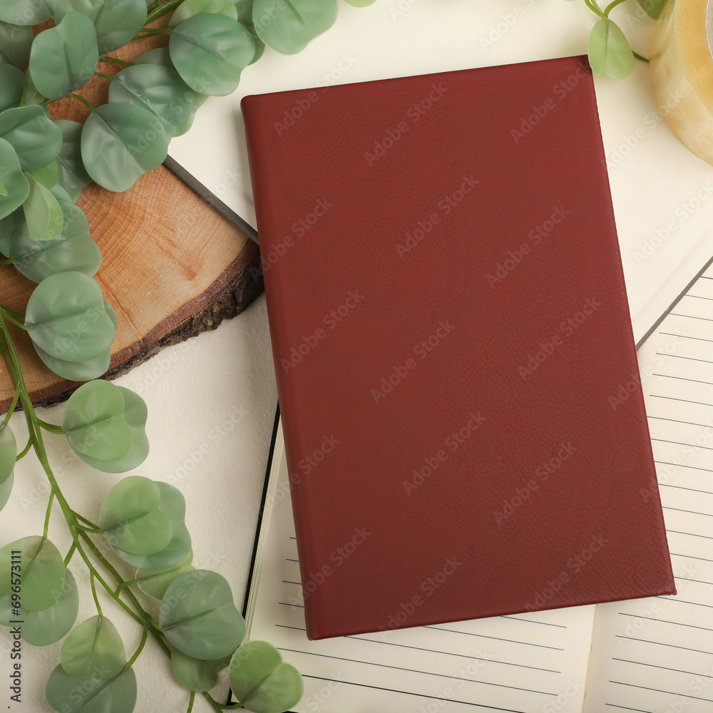 Leather Journals and Notebooks in rose colors. Concept shot, top view ...