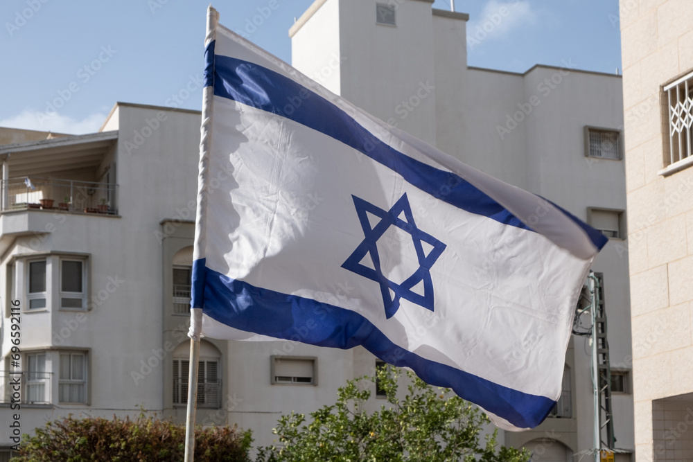National Israeli flag waving in the background of a typical apartment ...