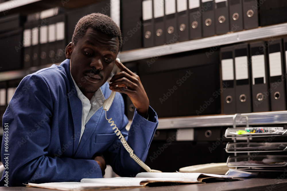 Police officer explaining confidential case to remote inspector using ...