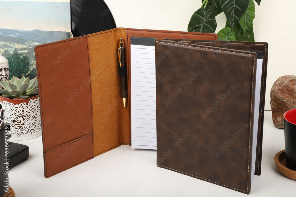 Leather portfolio. Concept shot, top view, portfolio in different ...