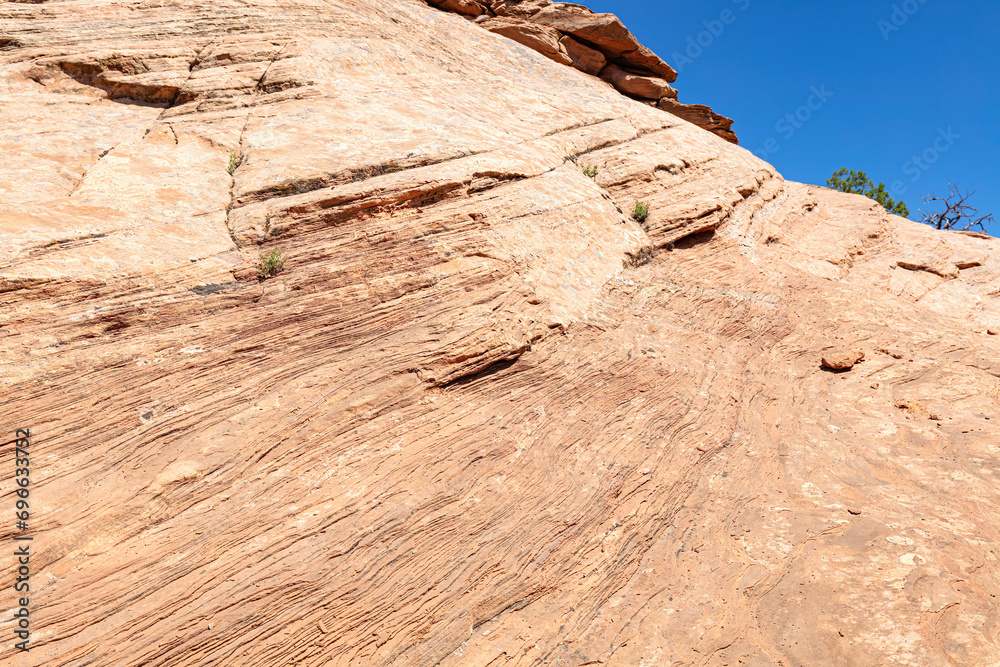 Closeup of the red sandstone hillside in the arid, dry, desert ...