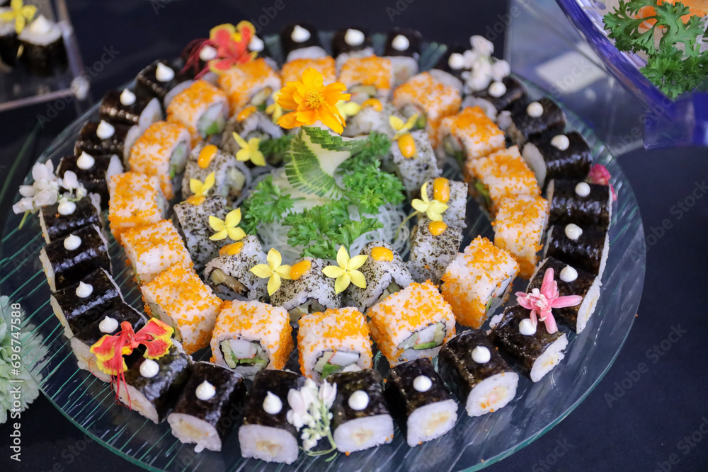 Japanese sushi food dish display. Maki ands rolls with tuna, salmon ...