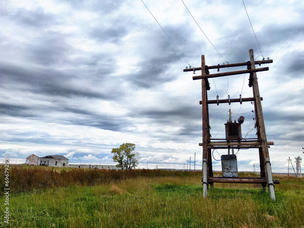 Old power poles and the sky with clouds in the background. Electric ...