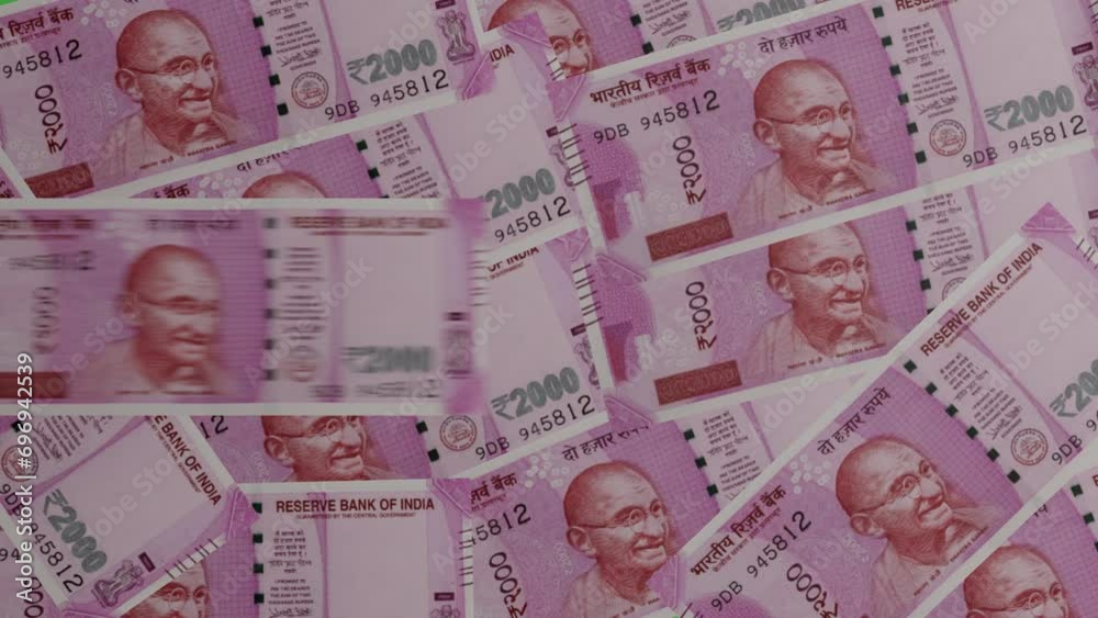 Indian rupee banknotes spread out. Note unrolling and rolling back 4k ...