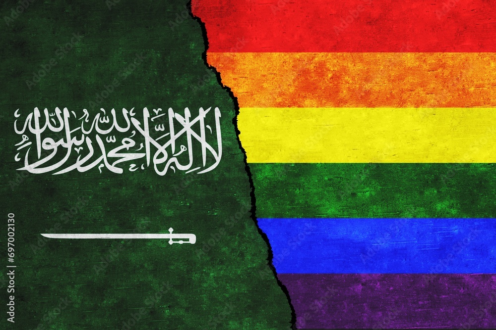 Saudi Arabia and LGBTQ painted flags on a wall with a crack. Saudi ...