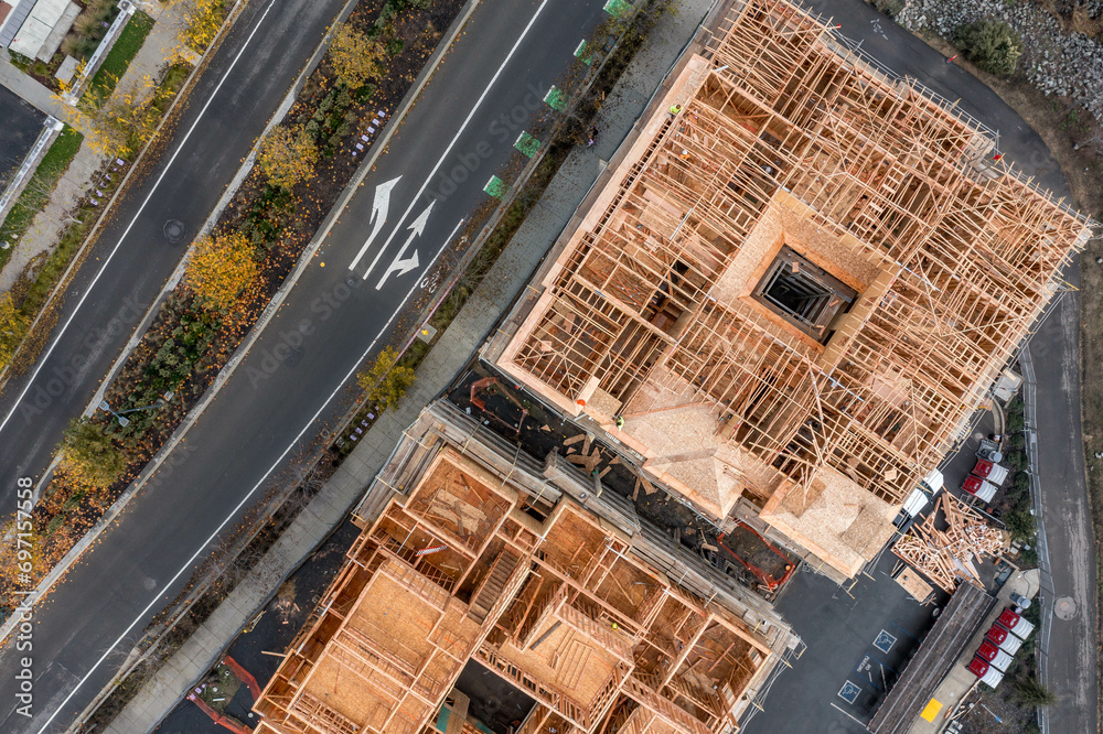 Top down aerial view over a construction site of apartment buildings ...