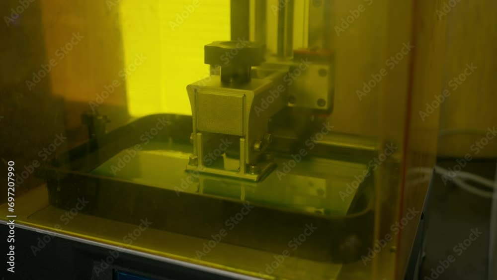 Using the 3D printer device at the modern dental clinic. 3D printer ...
