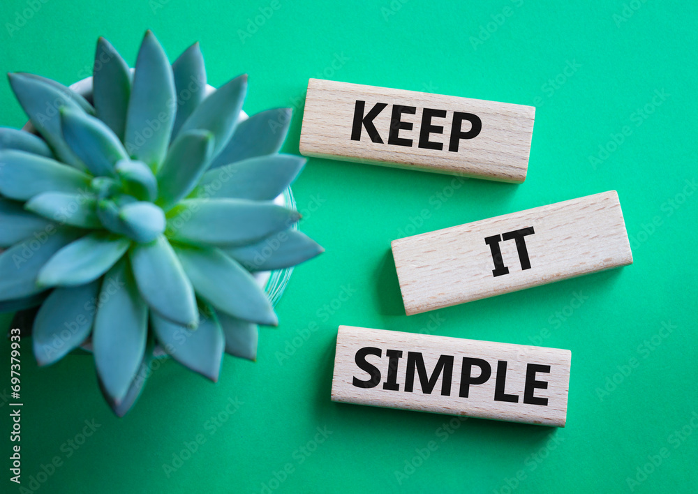 Keep it Simple symbol. Concept words Keep it Simple on wooden blocks ...