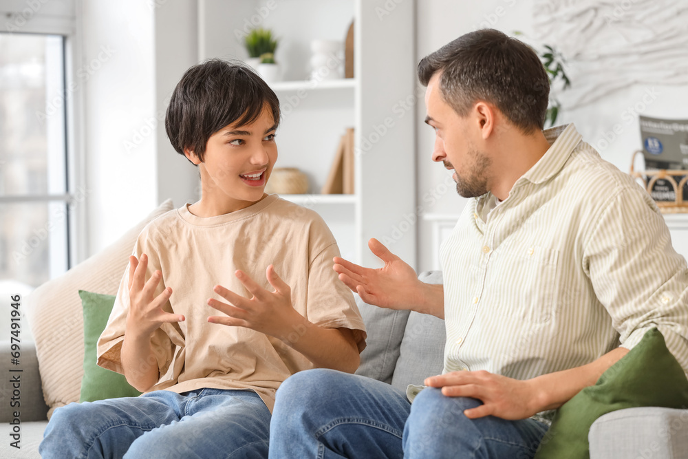 Teenage boy arguing with his father at home. Family problem concept ...