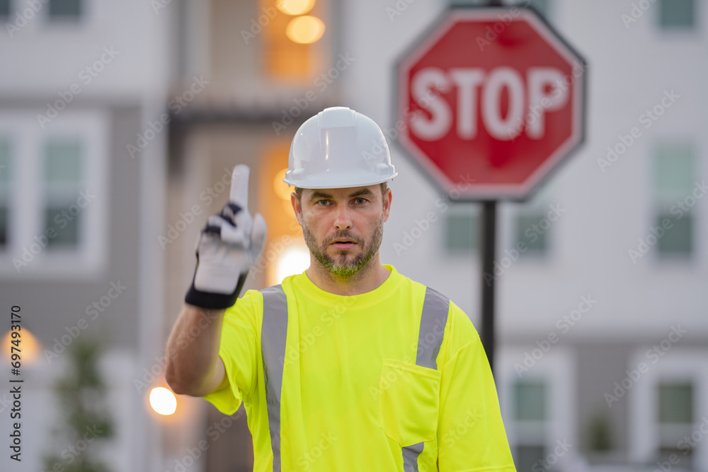 Worker with stop road sign. Builder with stop gesture, no hand ...